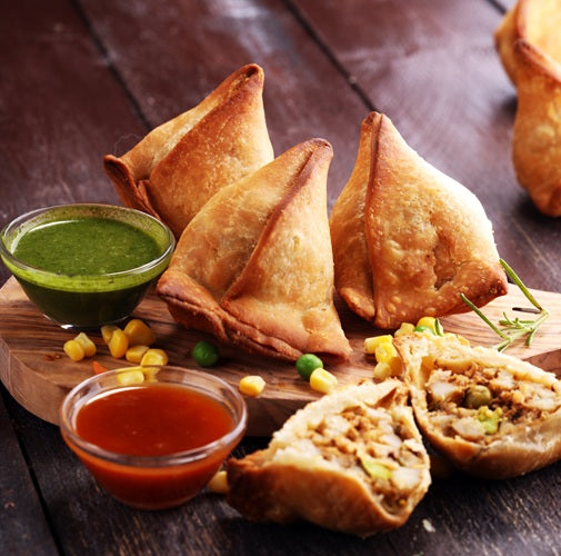 Samosa is a fried Asian Pastry with a Savory Filling of Spiced Vegetab ...